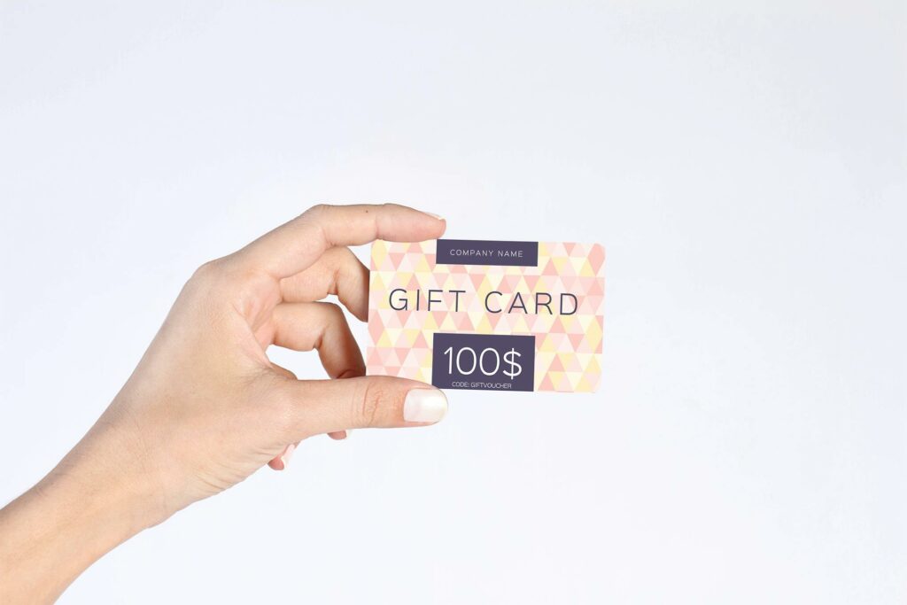 Hand Holding Gift Card Mockup | Design Shack