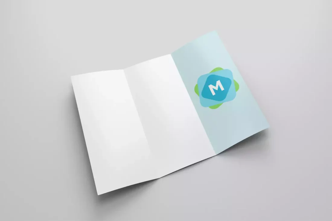 Tri-Fold Brochure on Table Mockup | Design Shack